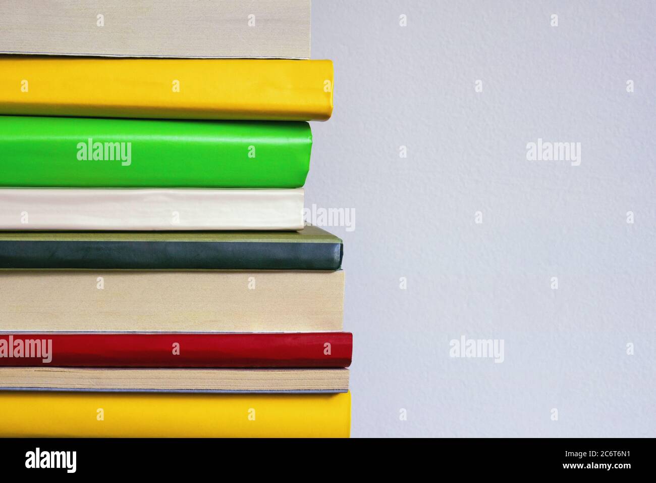Vertical stack of colorful books. Free space for text Stock Photo - Alamy