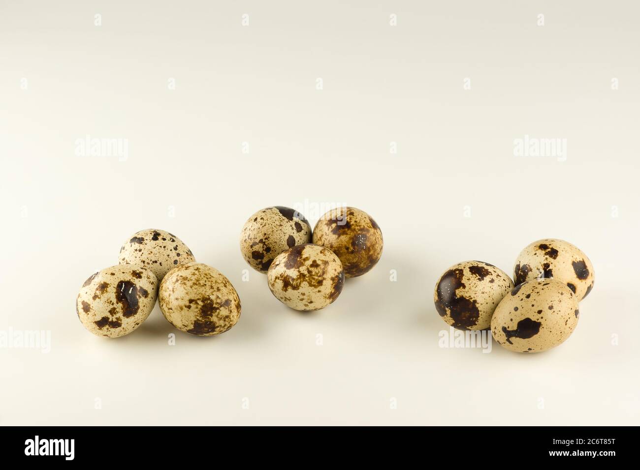 many quail eggs isolated on white background Stock Photo - Alamy