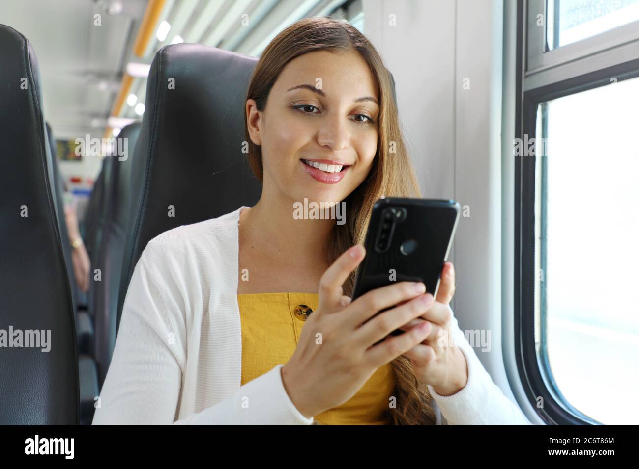 Smiling girl in subway train hi-res stock photography and images - Alamy