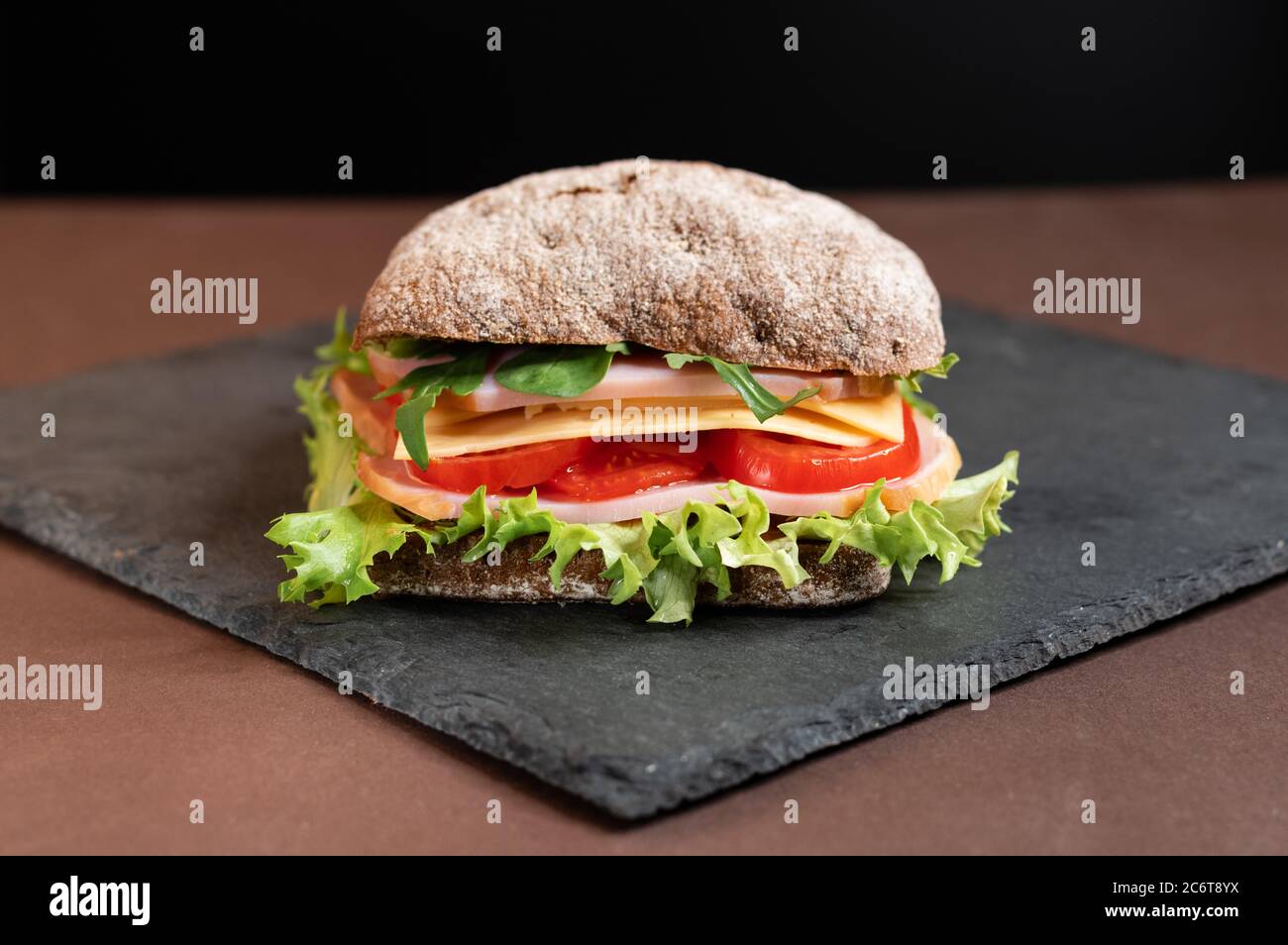 Sandwich on a slate board. Sandwich from the menu. Front view Stock ...