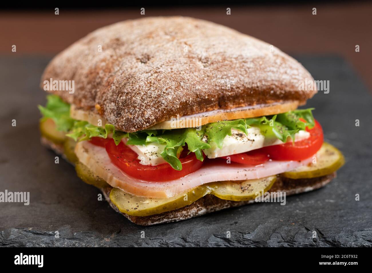 Photo of a sandwich in a tight. Macro photo of a sandwich. Front view ...