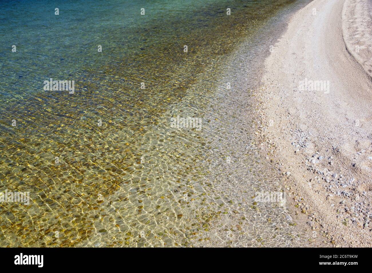 Sand beach of sea on calm sunny day, background. Radial color gradient ...