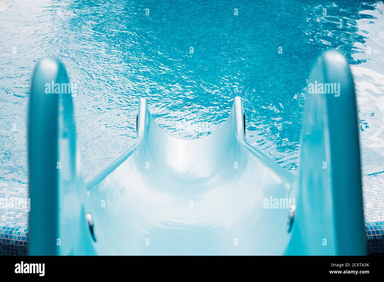 Blue swimming pool with water slide for background, high resolution ...