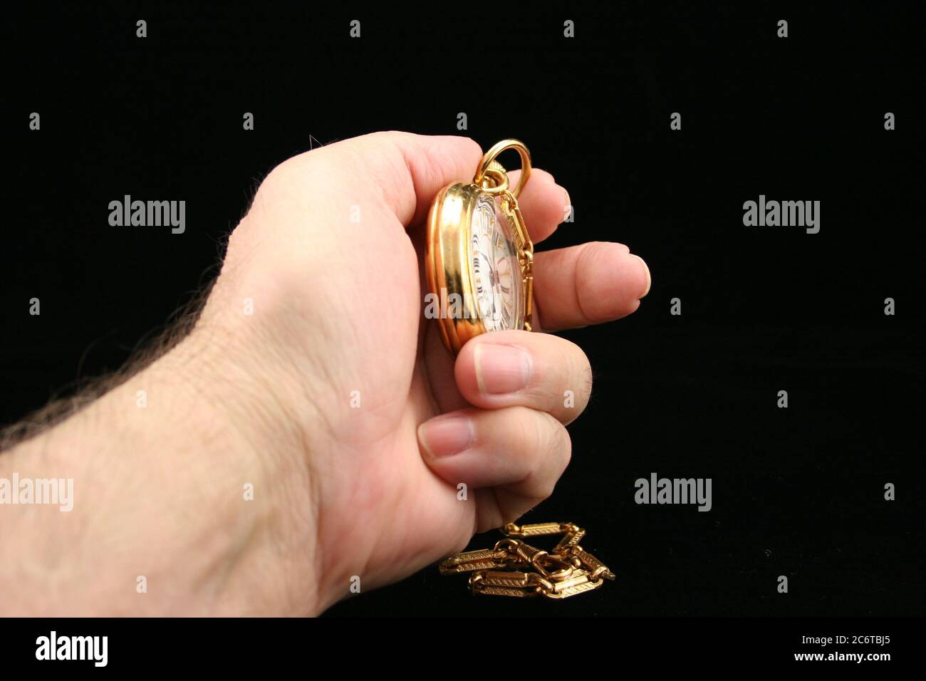 Hand holding watch on chain hi-res stock photography and images - Alamy