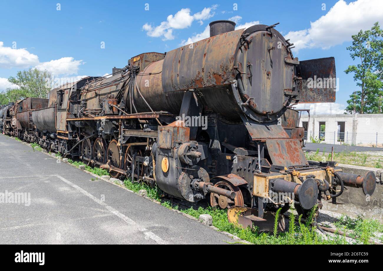 Old, rusty abandoned train. Corroded vintage locomotive Stock Photo - Alamy