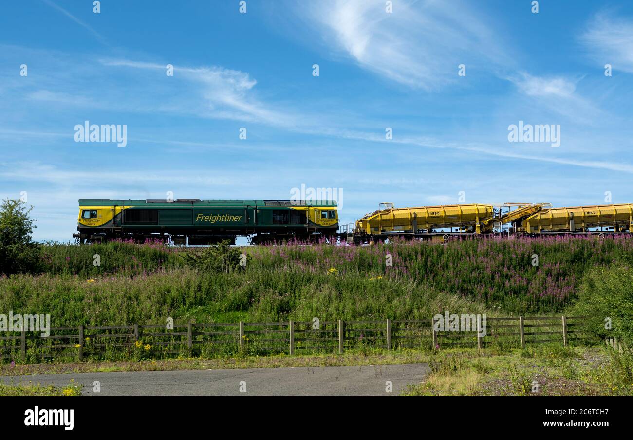 Freightliner class 66 diesel locomotive No. 66414 at the rear of a ...
