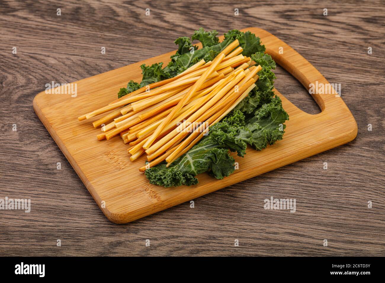 Caucasian Chechel cheese sticks over board Stock Photo - Alamy