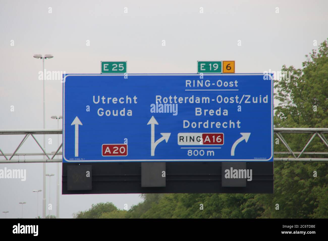 Direction sign in blue and white heading Gouda and Utrecht on motorway ...