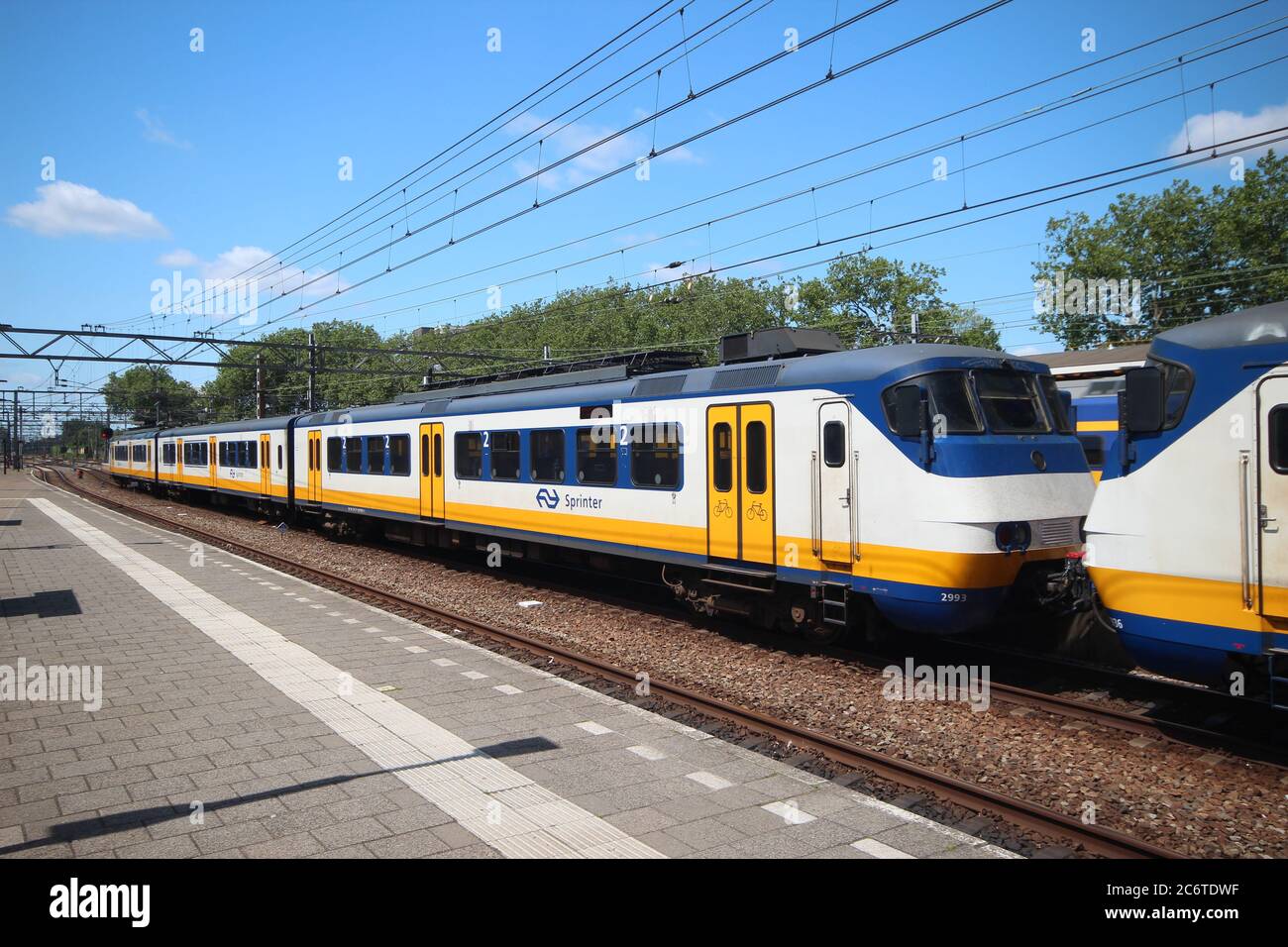 SGM sprinter from NS in blue and white along platform at station ...