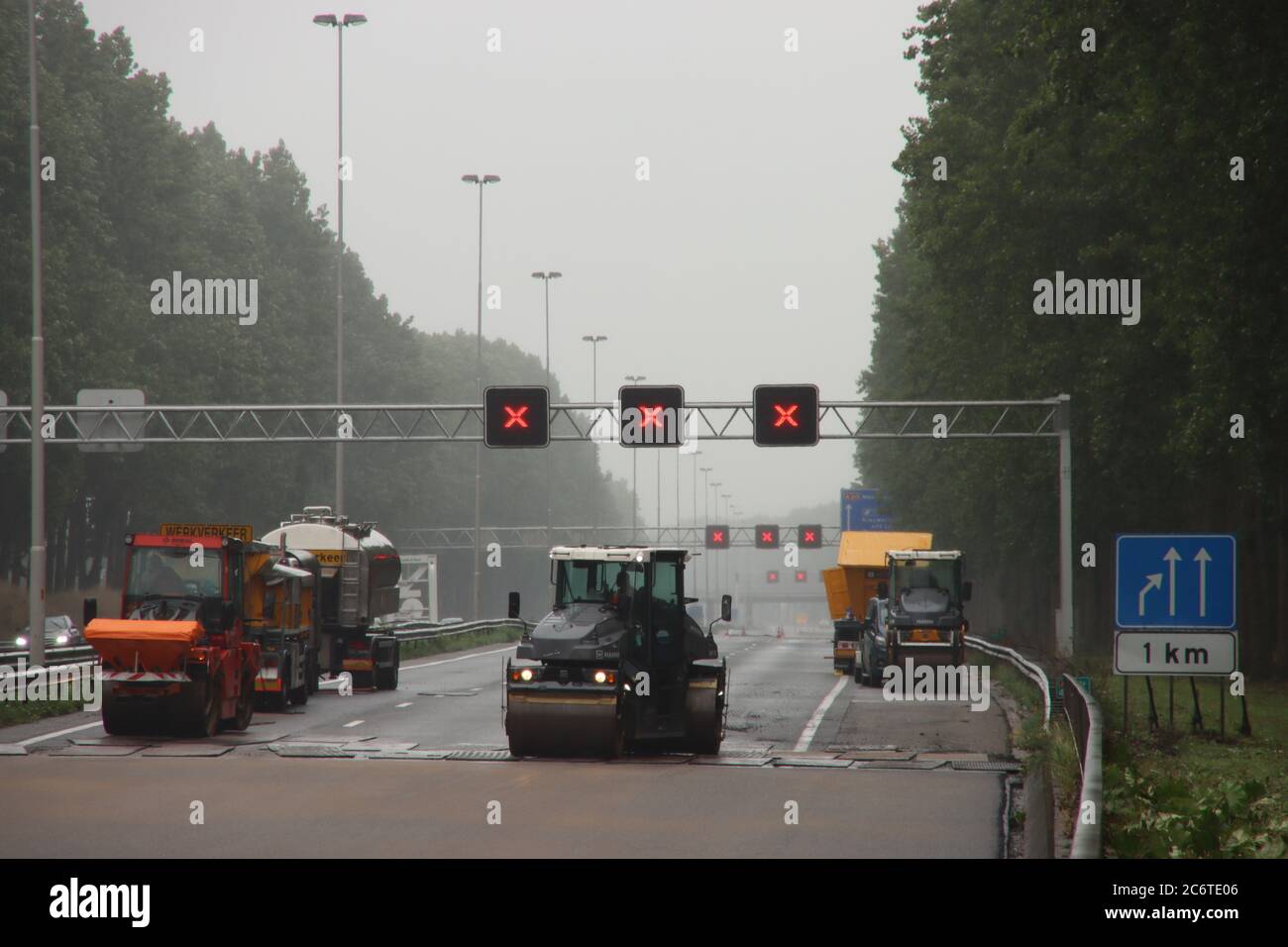 roller to flatten the asphalt during the reconstruction of the A20 ...