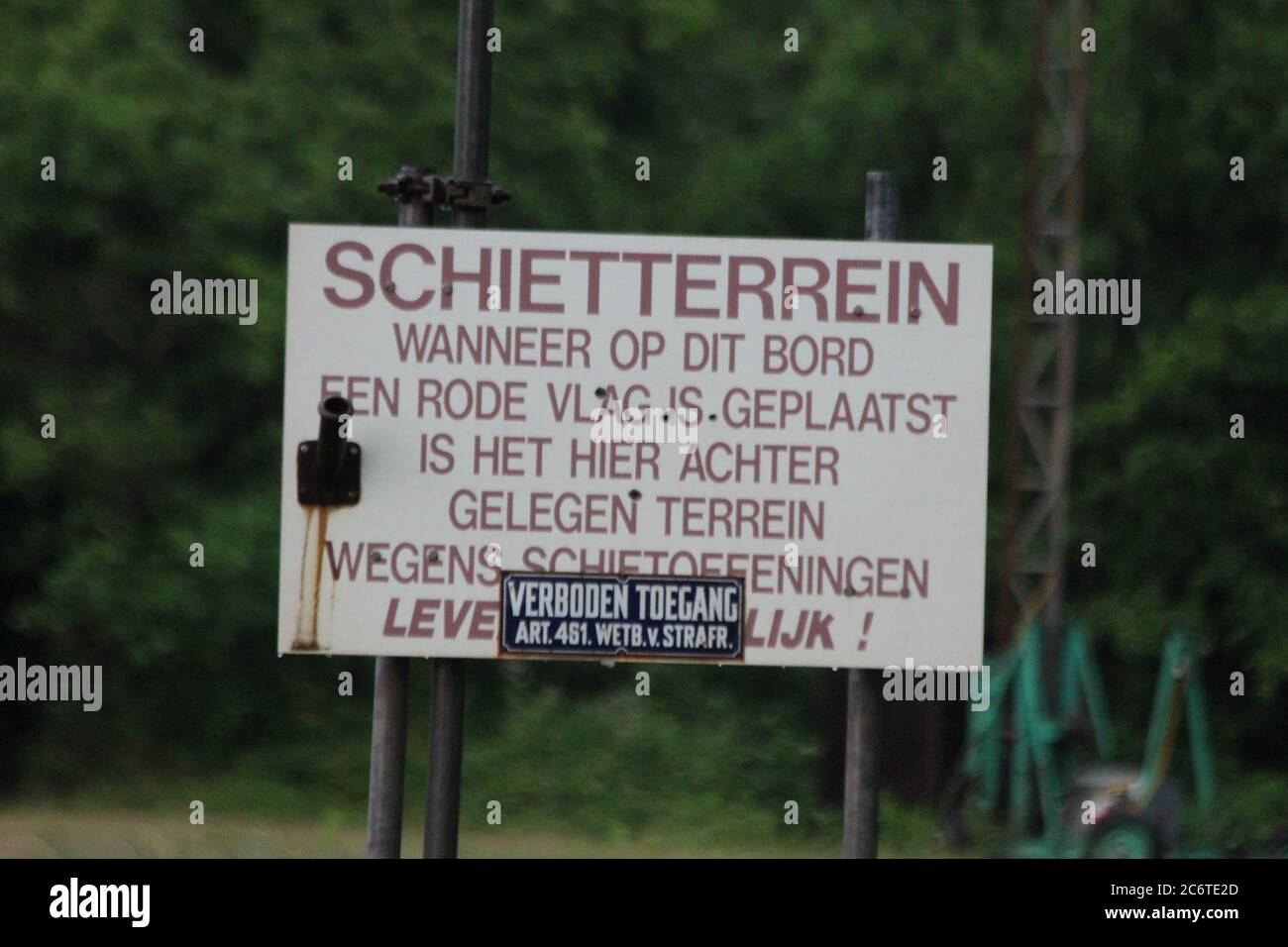 Warning sign at clay pigeon shooting range when red flag hangs there is ...