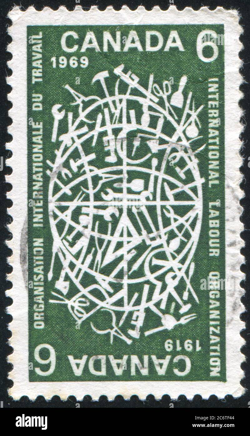 CANADA - CIRCA 1969: stamp printed by Canada, shows Globe and Tools of ...