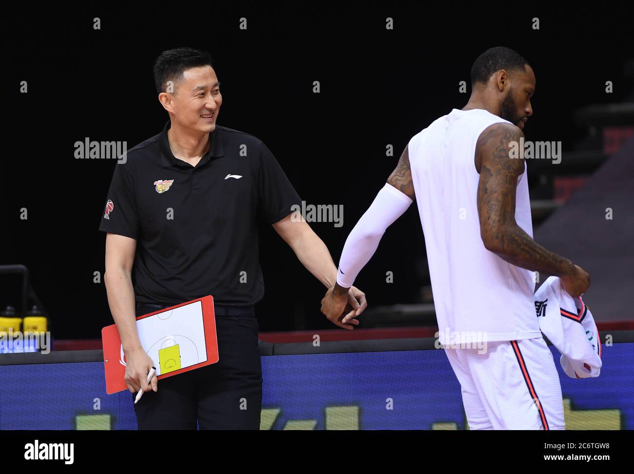 Qingdao, China's Shandong Province. 12th July, 2020. Du Feng (L), head ...