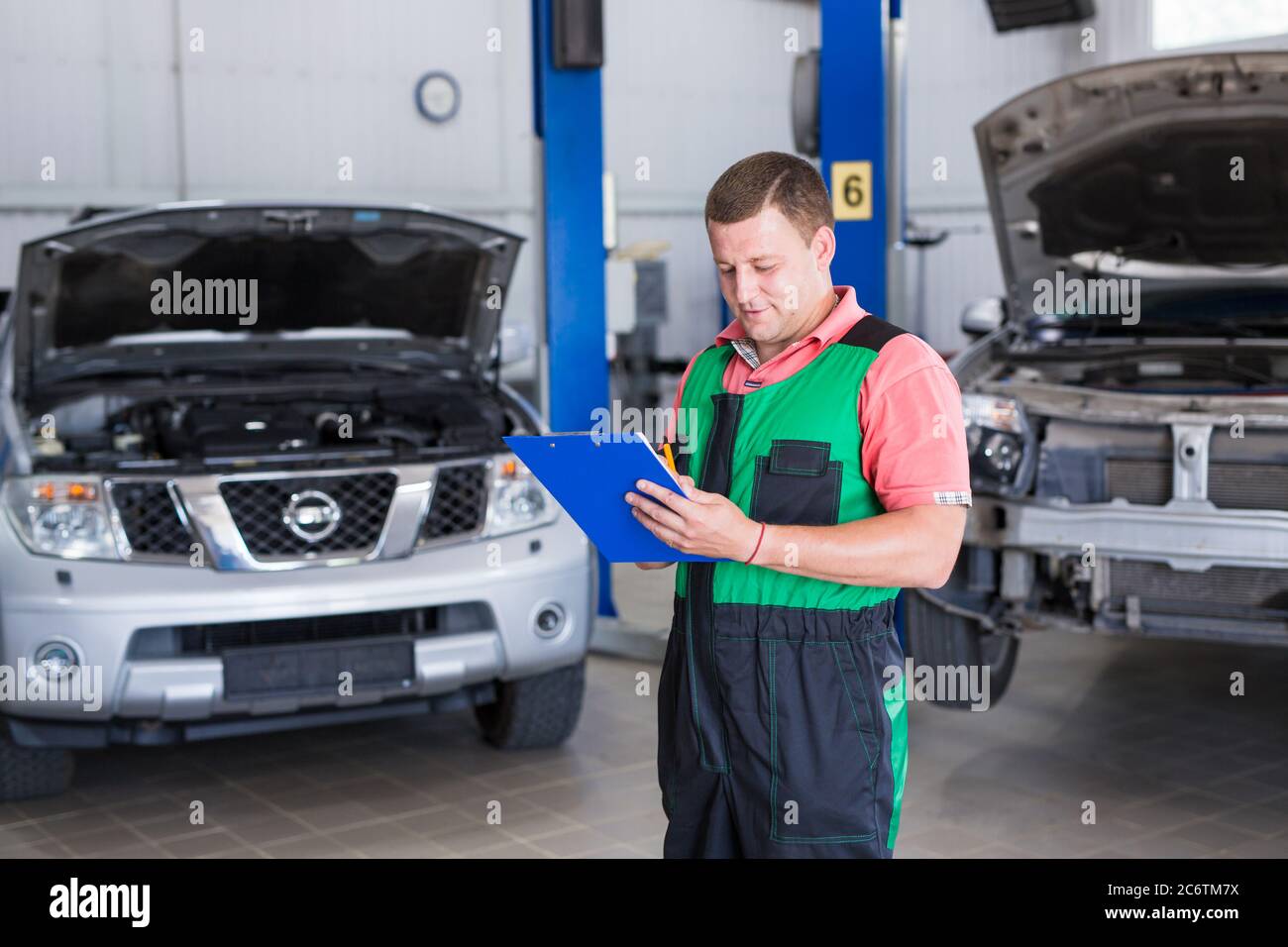 Male working car engine transportation automotive repairs hi-res stock ...