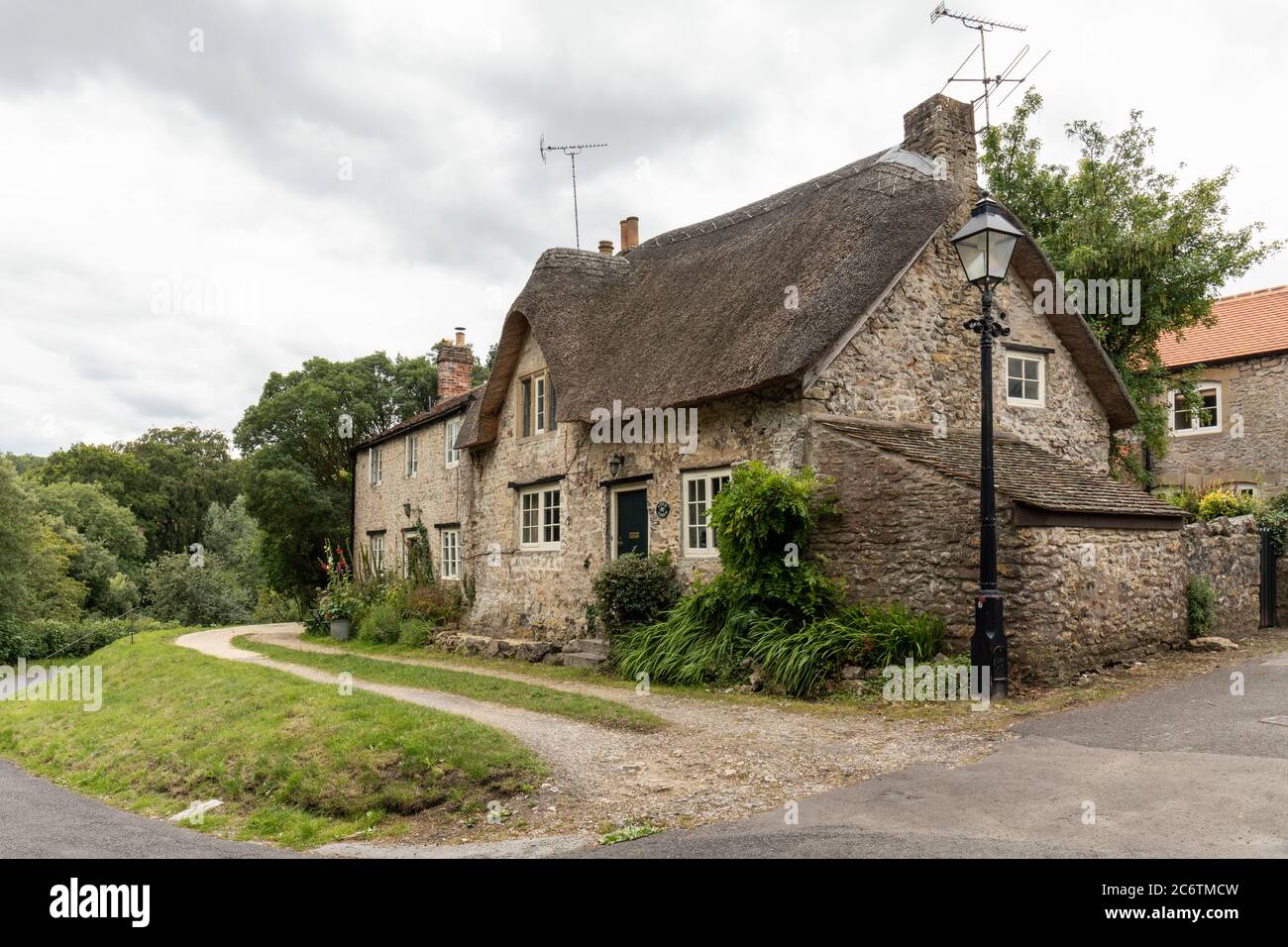 A picturesque thatched cottage in Mells village, Mells, Somerset ...