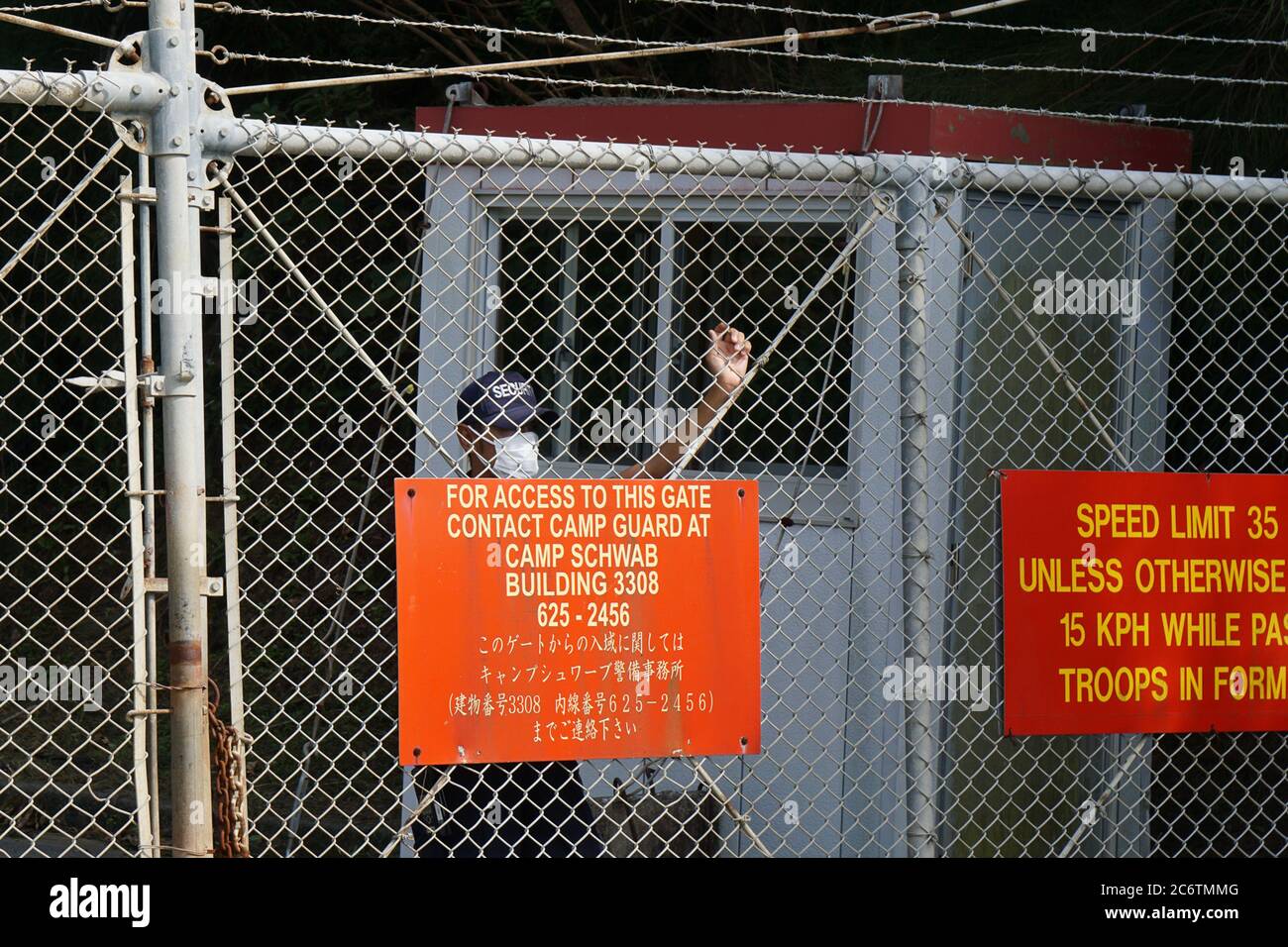 Nago, Okinawa, Japan. 24th Sep, 2019. A security staff wearing a face ...