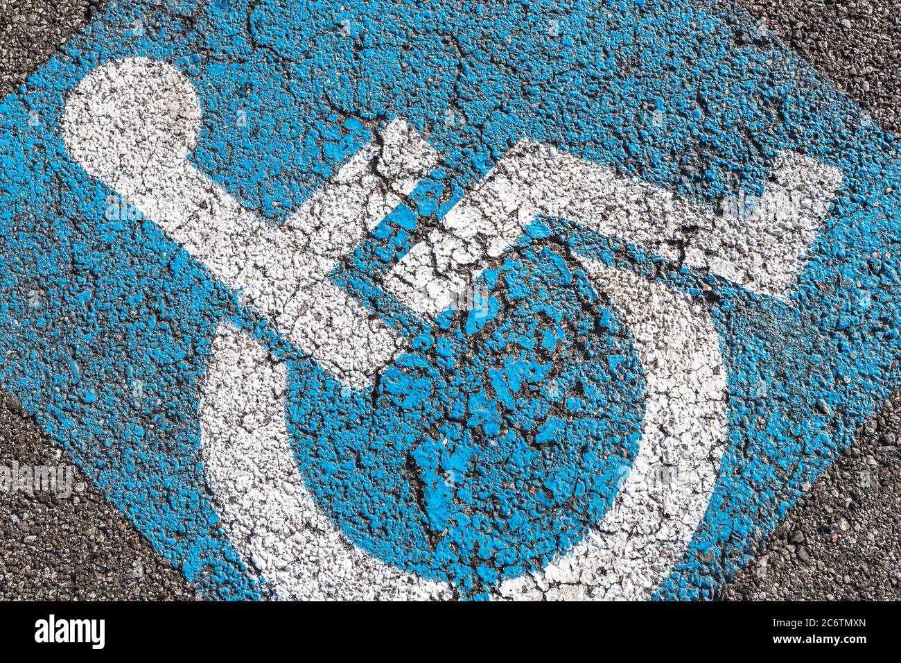 Handicap parking sign painted on road space. For disabled or ...