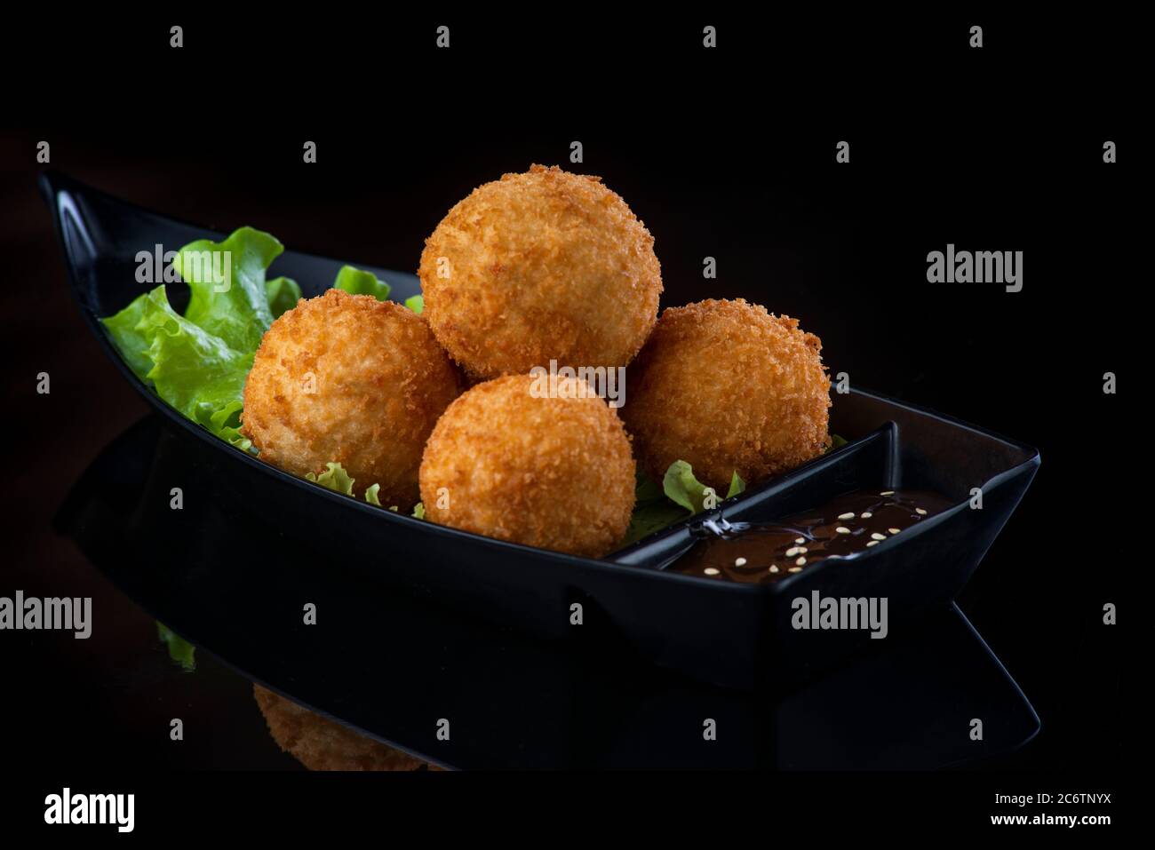 A box filled with different types of food. cheese balls Stock Photo - Alamy