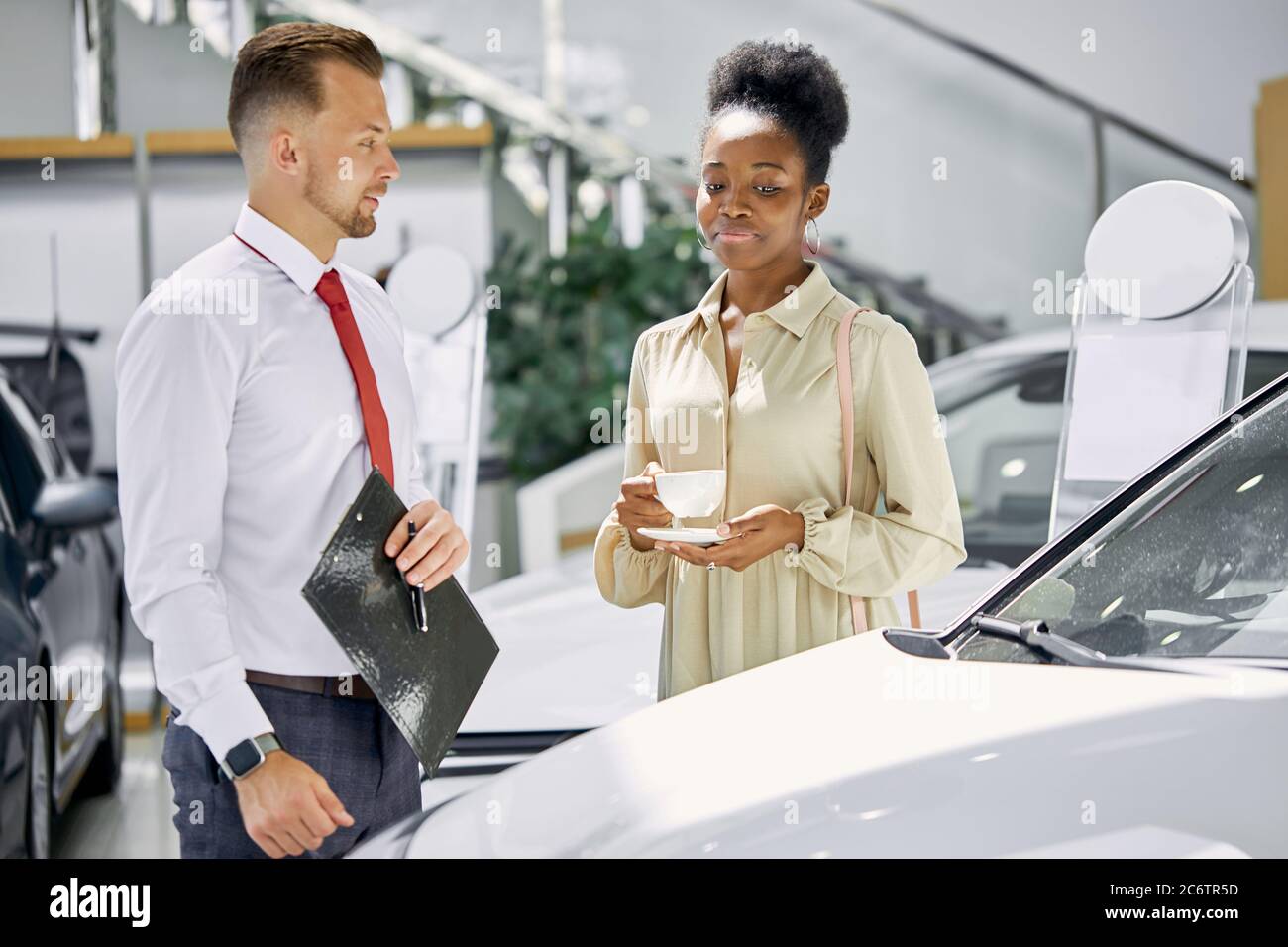 A car salesman talks to hi-res stock photography and images - Alamy