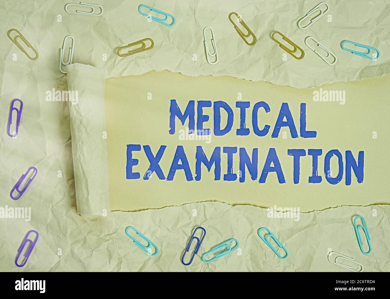 Writing note showing Medical Examination. Business concept for the ...