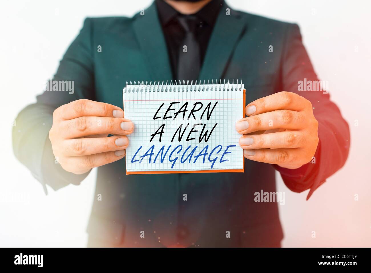 Writing note showing Learn A New Language. Business concept for ability ...
