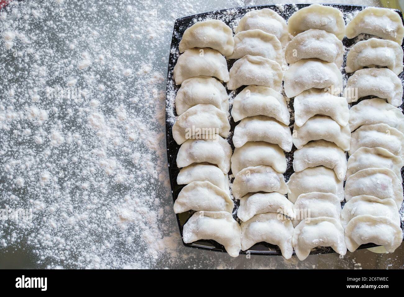 Dumplings - ukrainian traditional vareniki, filled with cherries on a ...