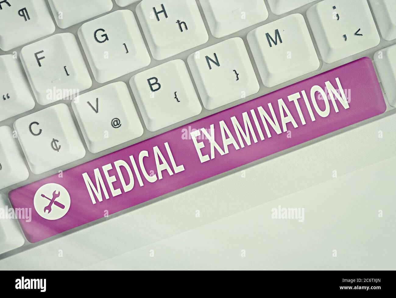 Writing note showing Medical Examination. Business concept for the ...