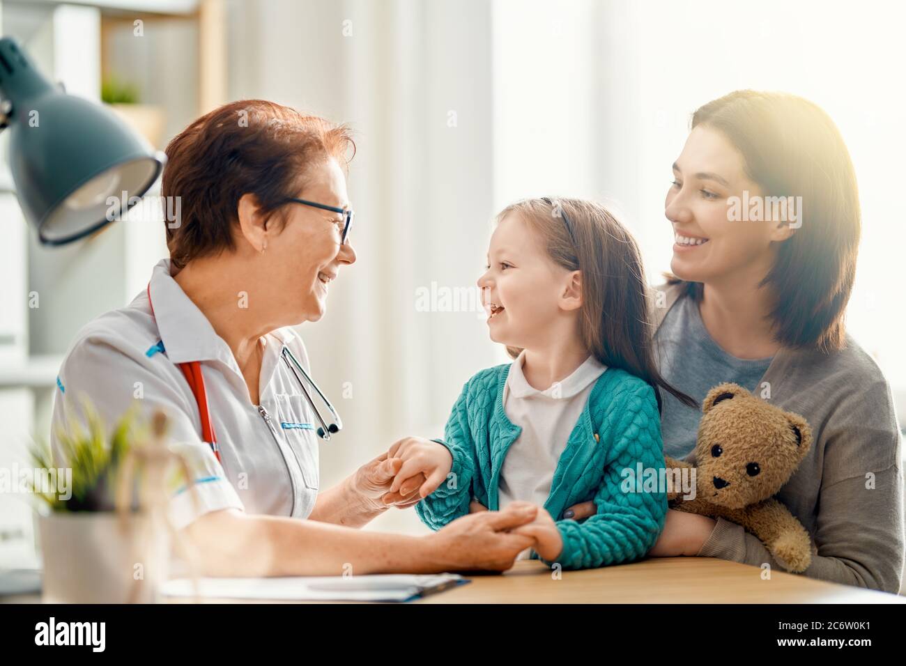 Child girl and her mother at a doctor's appointment Stock Photo - Alamy