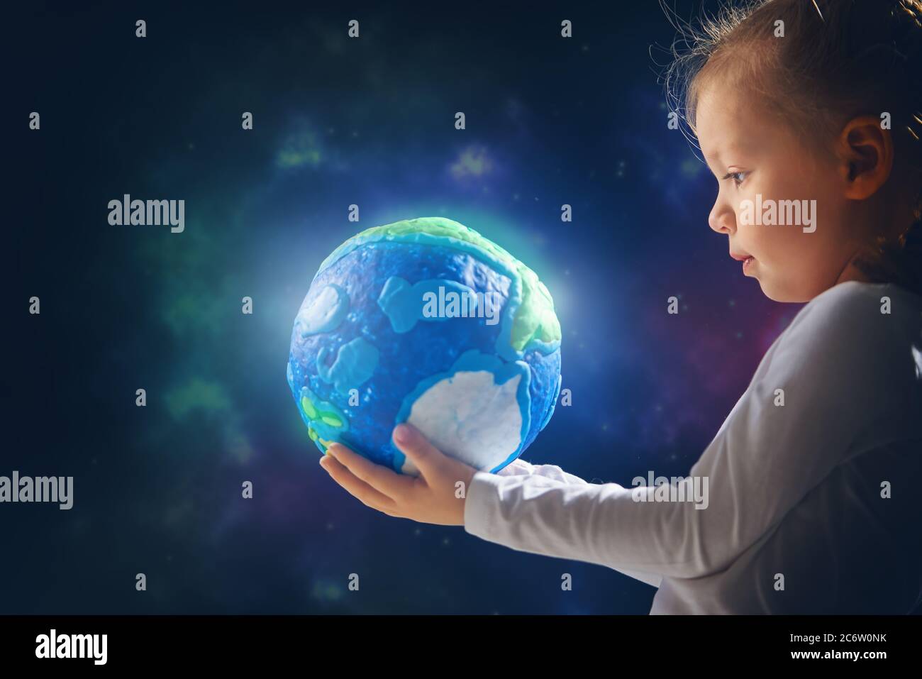 Child with globe. Happy Earth day Stock Photo - Alamy