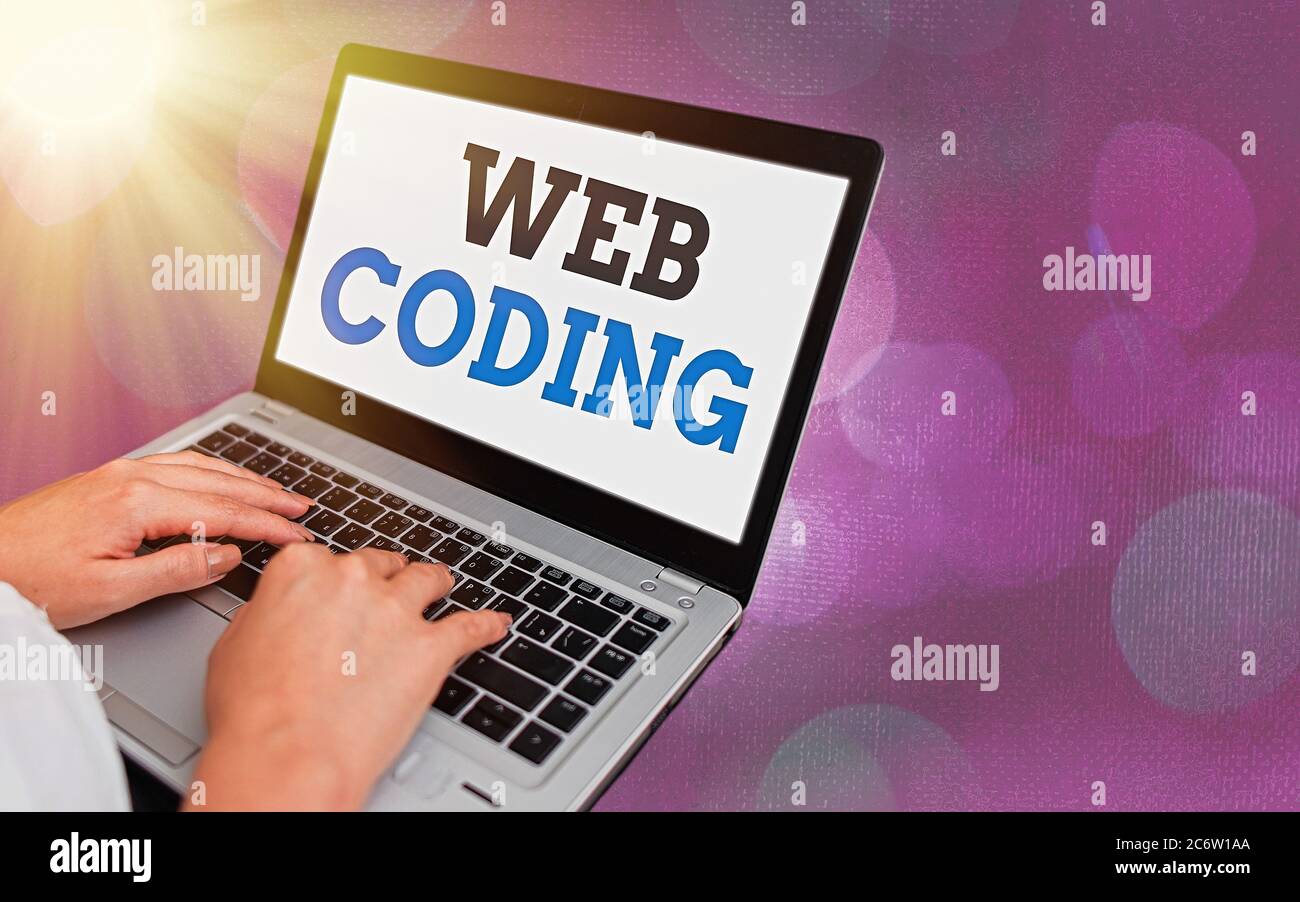 Writing note showing Web Coding. Business concept for a system of ...
