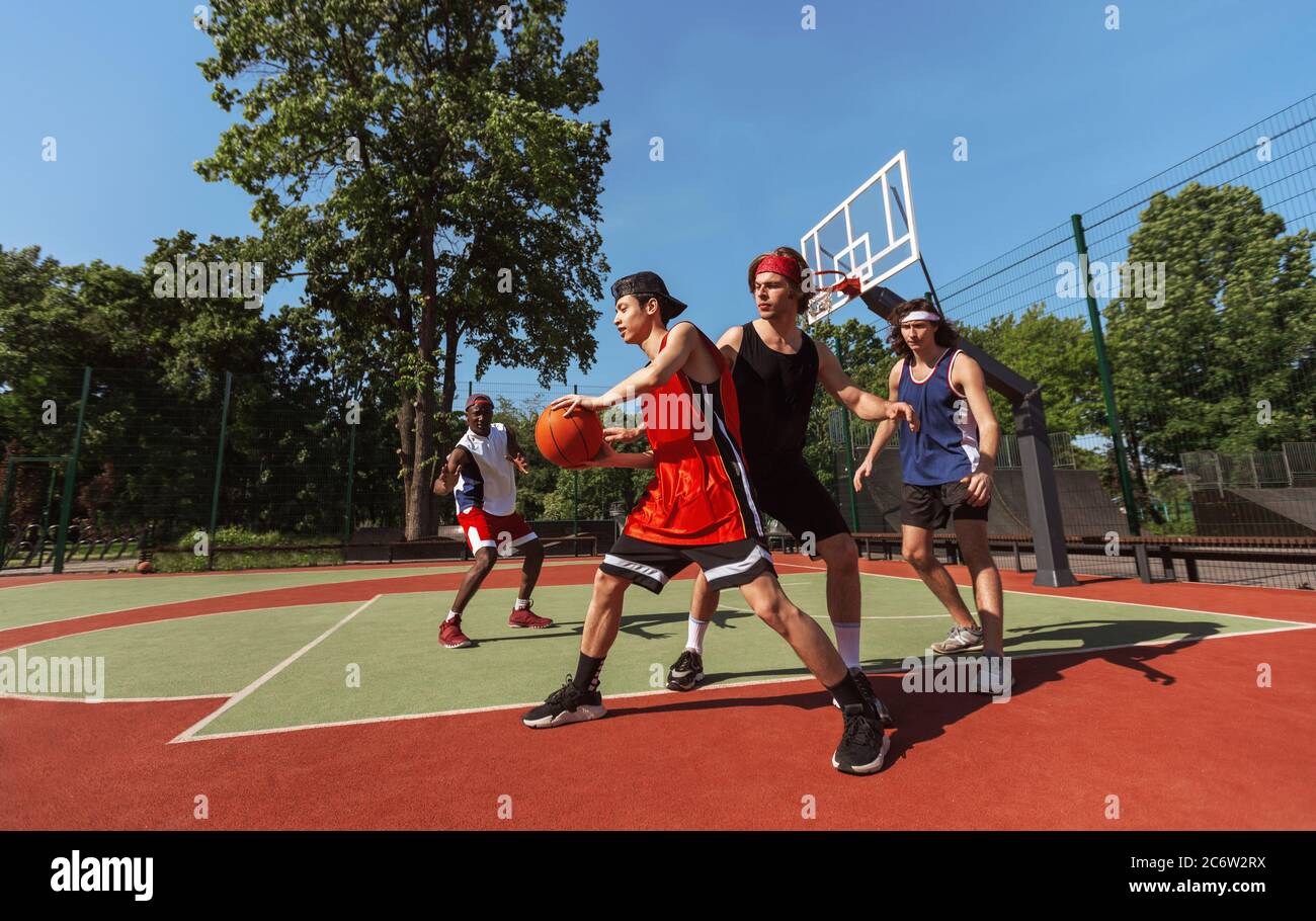 Diverse group of people playing sports hi-res stock photography and ...