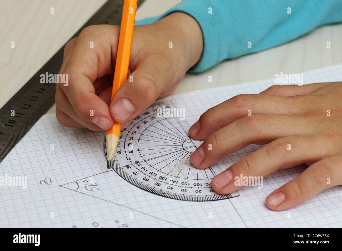 Hands measuring angle by protractor hi-res stock photography and images ...