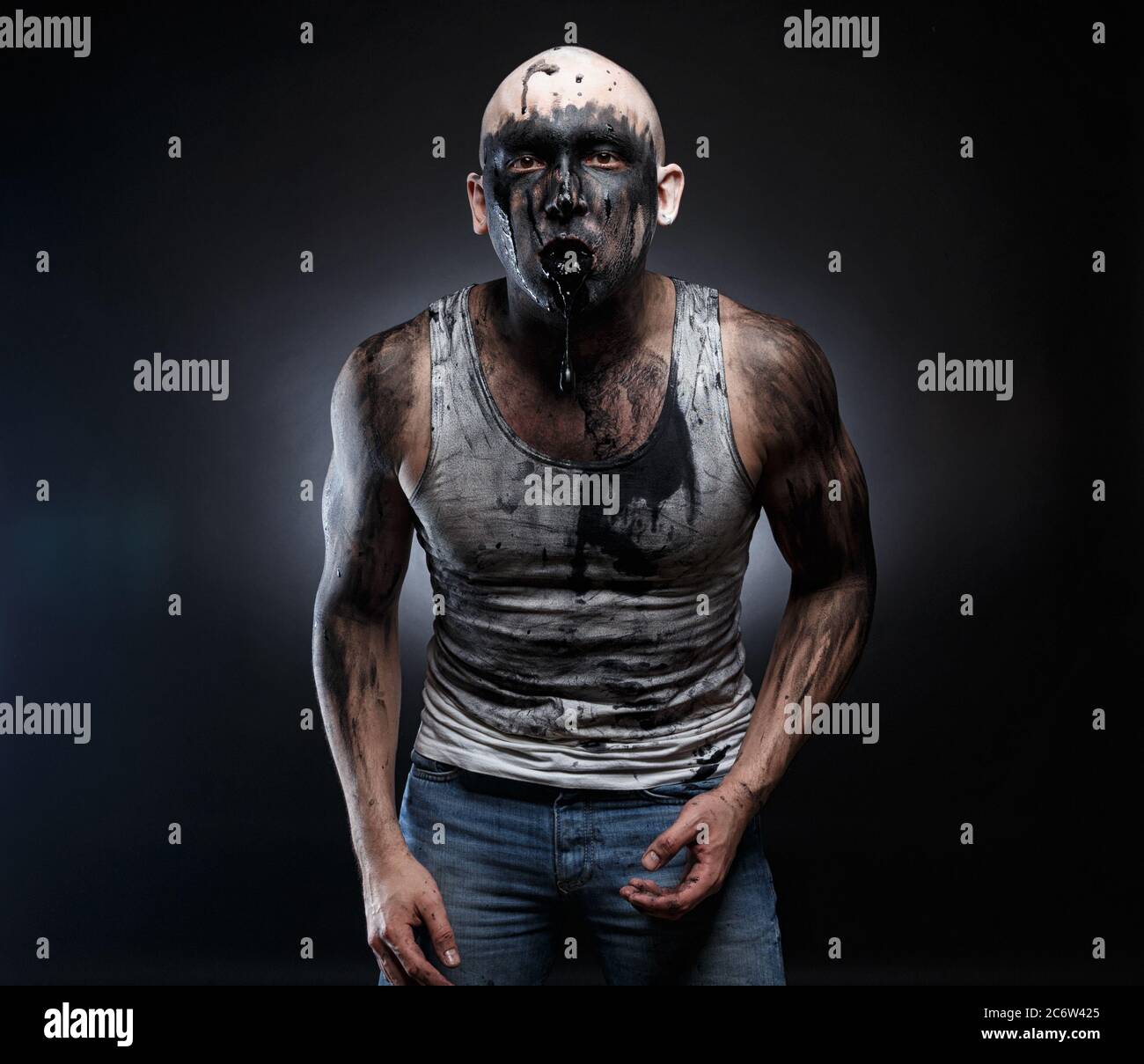 Photo of bald mad man with black vomit in the mouth Stock Photo - Alamy