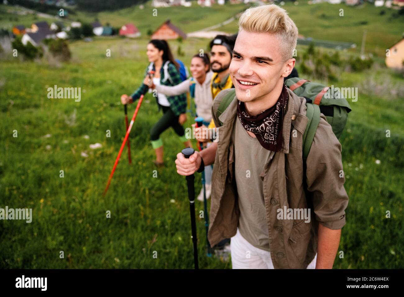 Trekking, hiking, camping and wild life concept. Group of friends ...