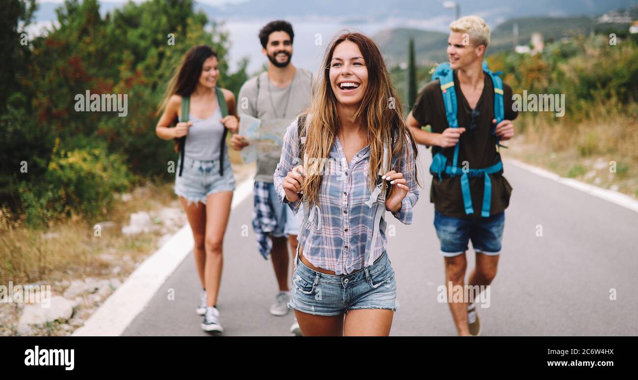 Group of happy friend traveler walking and having fun. Travel lifestyle ...
