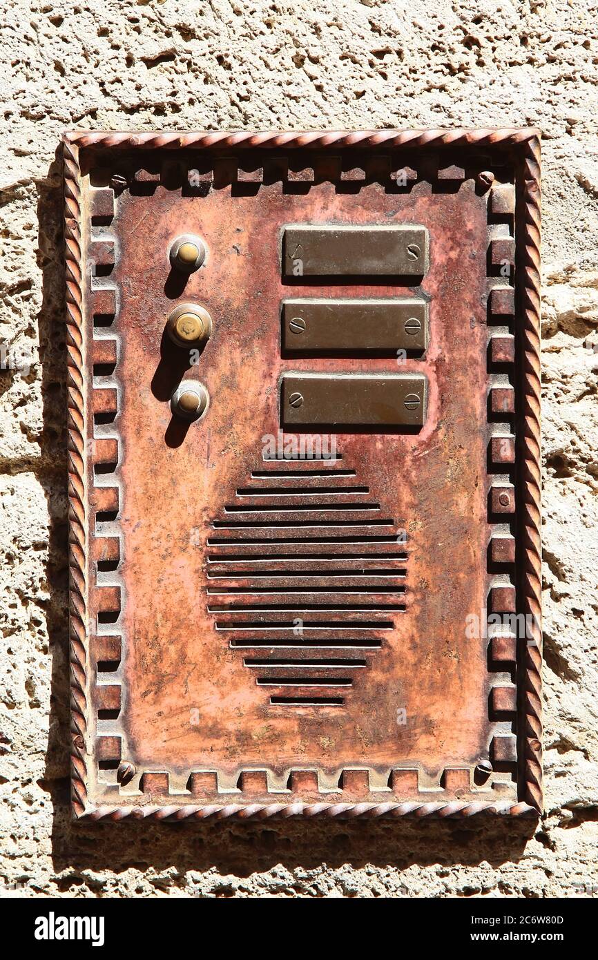 Vintage aged iron rusty wall mounted doorbell with brass buttons ...
