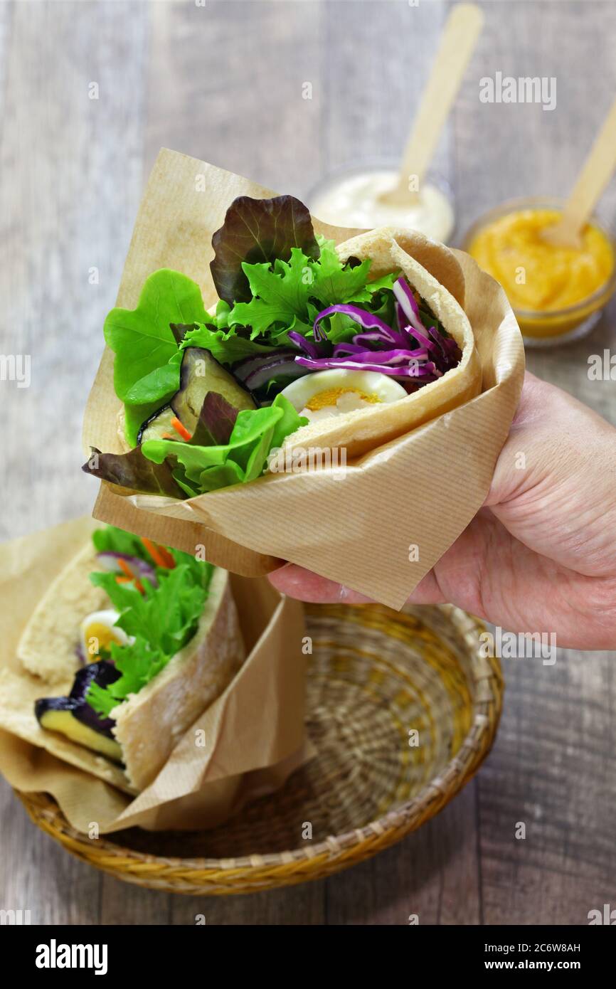 sabich: israeli pita sandwich with fried eggplant, hard boiled egg ...