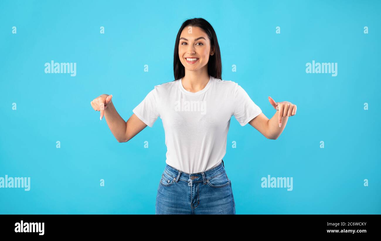 Woman laughing and pointing down hi-res stock photography and images ...