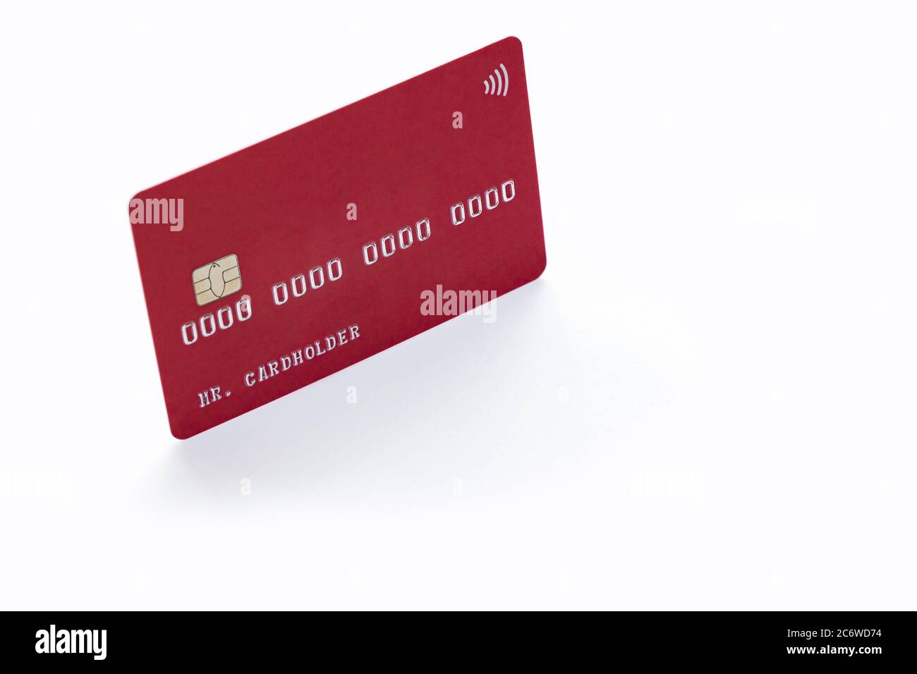 Red credit card on white background with natural shadow Stock Photo - Alamy