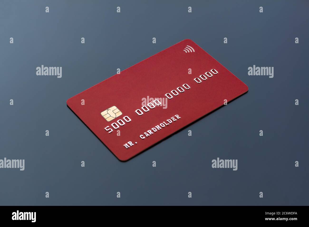 Red credit card on deep blue background Stock Photo - Alamy