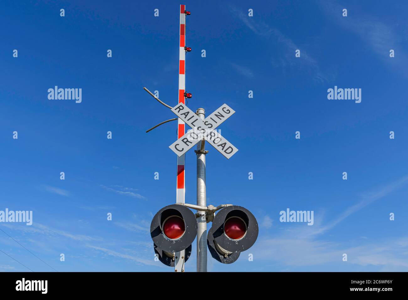 railroad crossing sign and gate in up position Stock Photo - Alamy