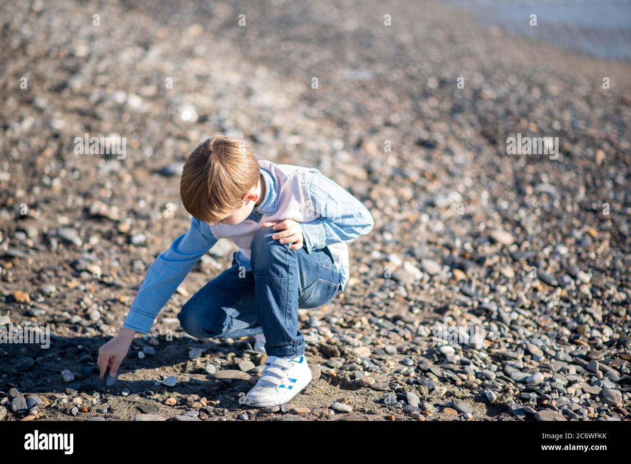 Collecting stone child hi-res stock photography and images - Alamy