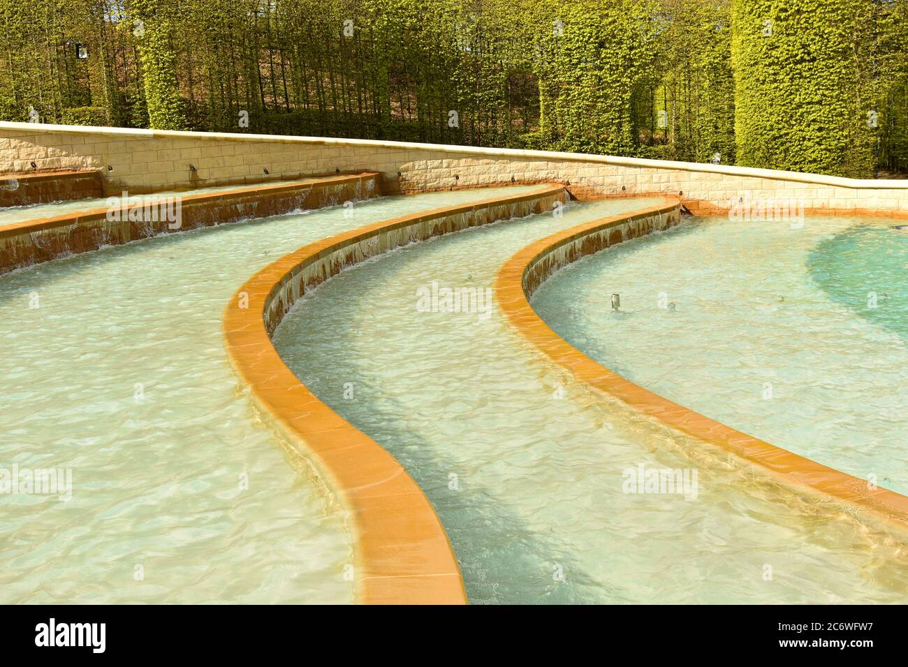 curved stone water fall feature creating a beautiful pattern Stock ...