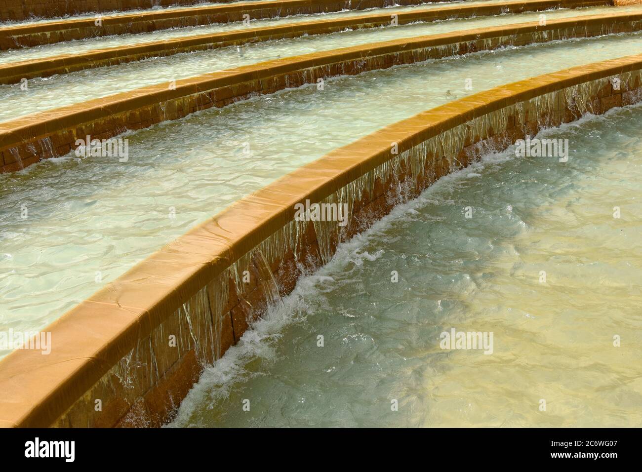 curved stone water fall feature creating a beautiful pattern Stock ...