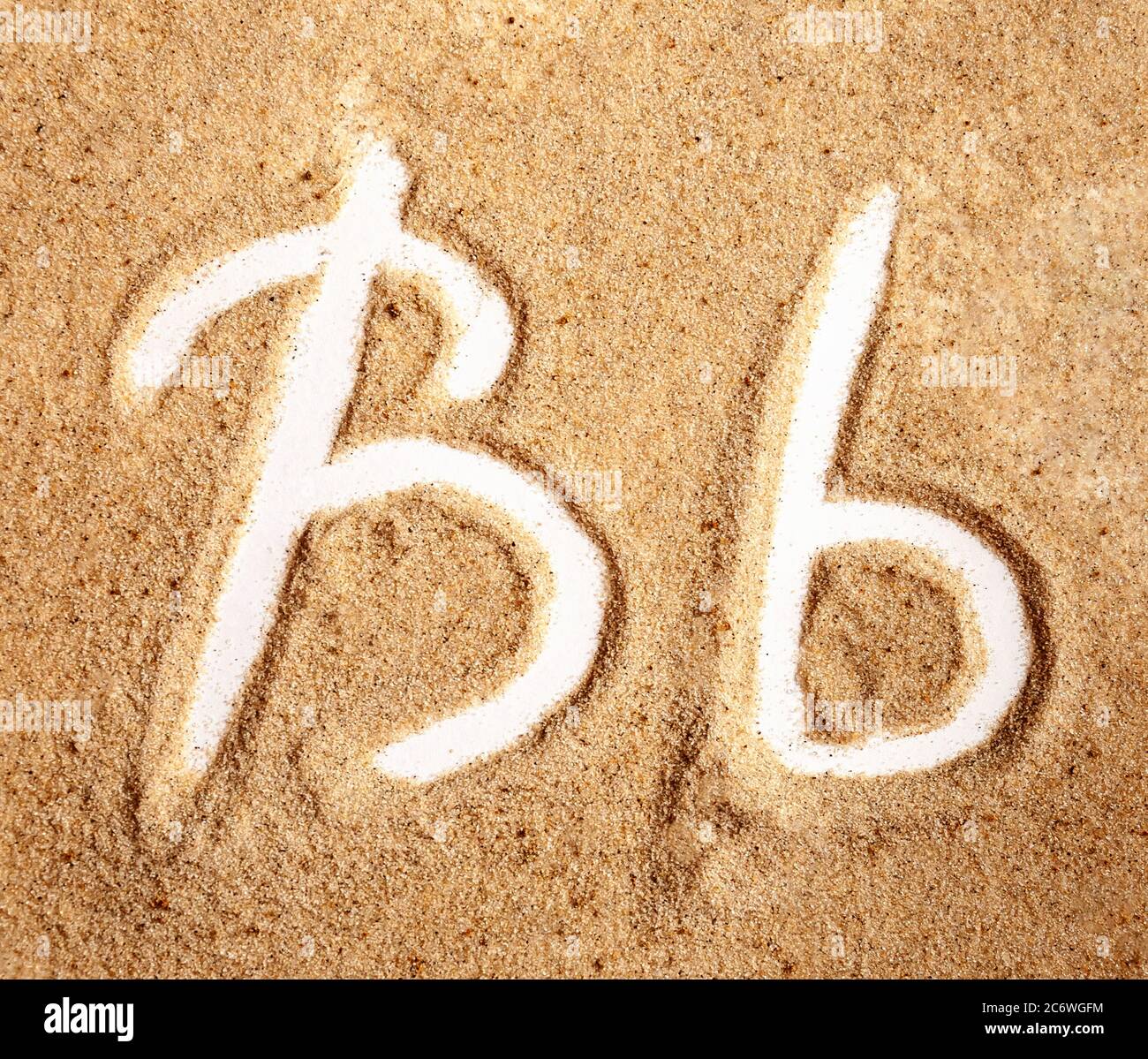 Letter B. English Handwritten Alphabet In The Sand Stock Photo - Alamy