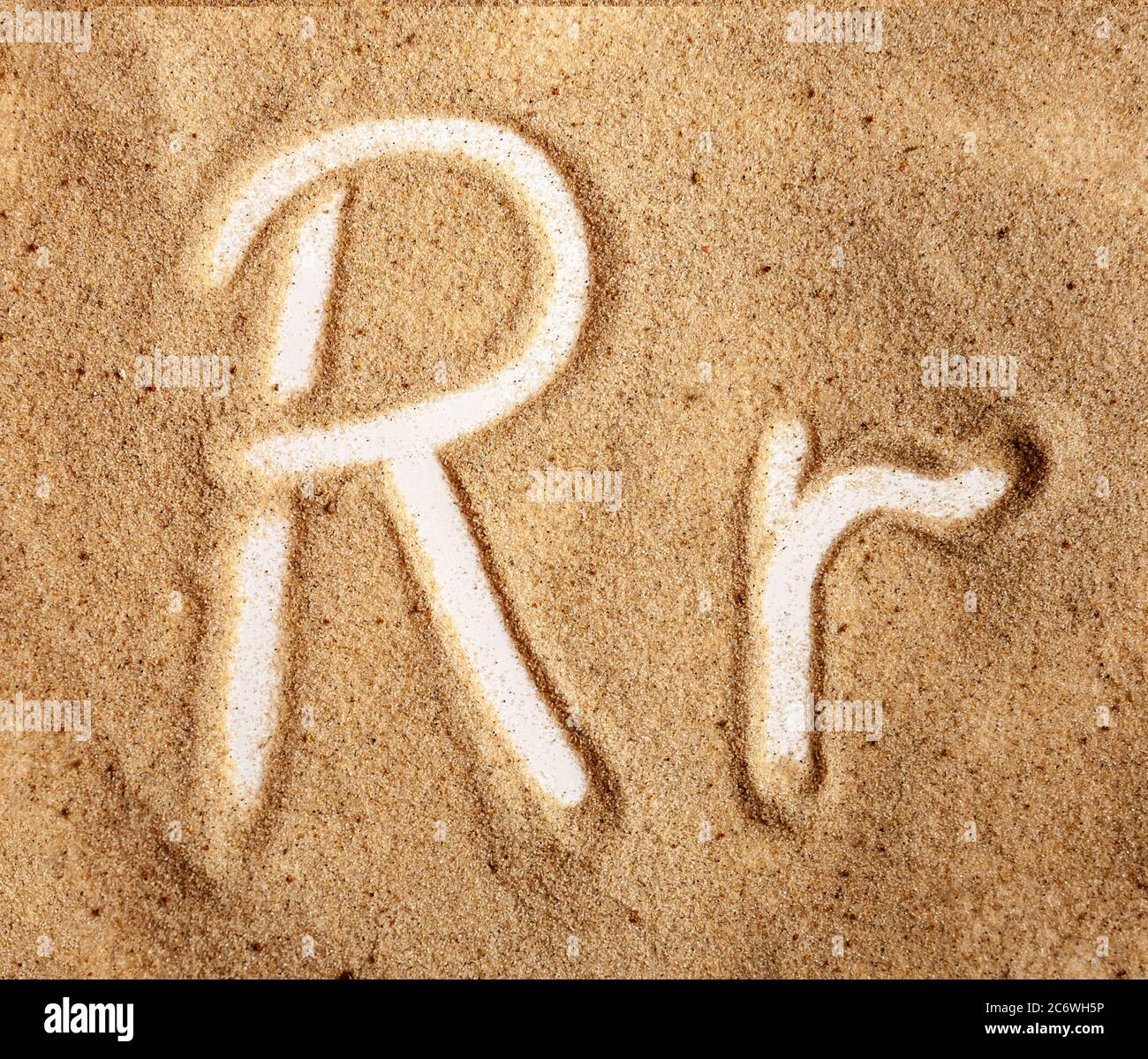 Letter R. English Handwritten Alphabet In The Sand Stock Photo - Alamy