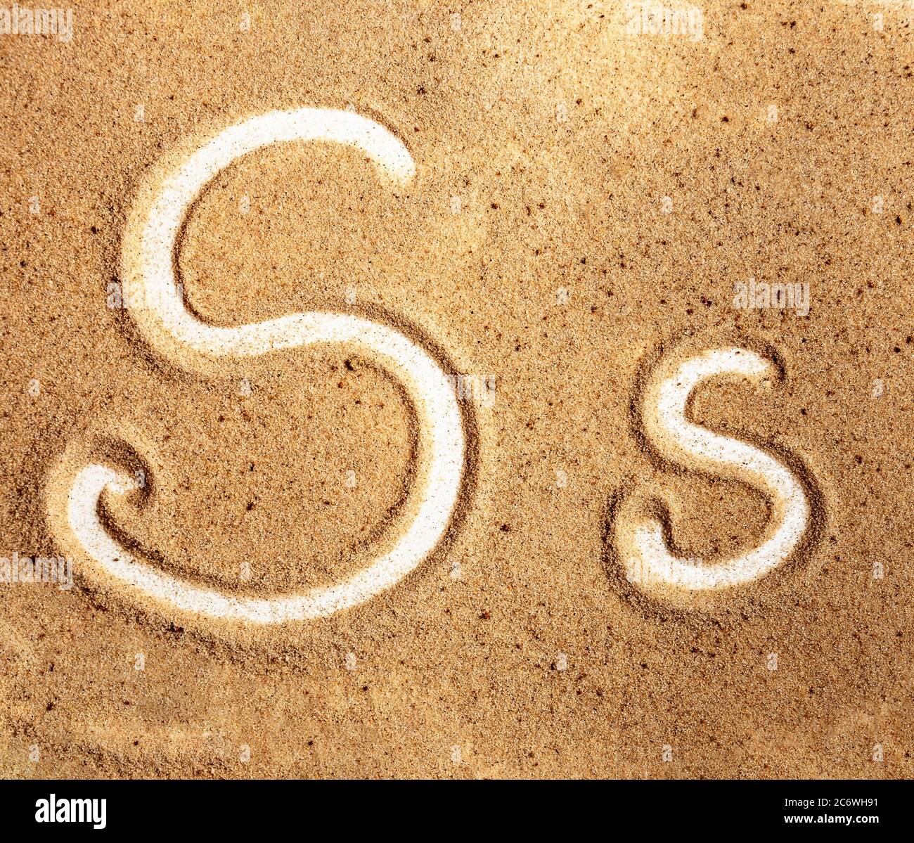 Letter S. English Handwritten Alphabet In The Sand Stock Photo - Alamy