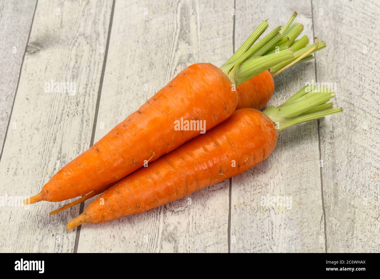 Three Young fresh ripe carrots Stock Photo - Alamy