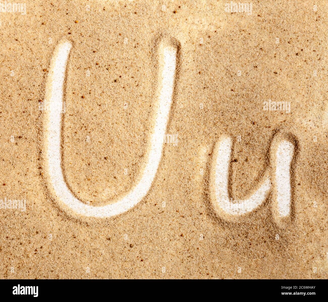 Letter U. English Handwritten Alphabet In The Sand Stock Photo - Alamy