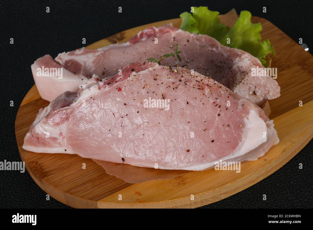 Raw pork meat steak ready for grill Stock Photo - Alamy
